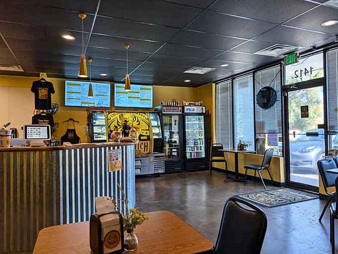 Step inside where yellow walls meet black ceilings, creating the perfect backdrop for your upcoming sandwich epiphany.