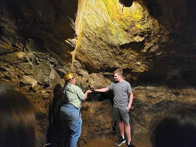 Your guide illuminates the rock face, revealing secrets that miners searched for with nothing but hope and determination.