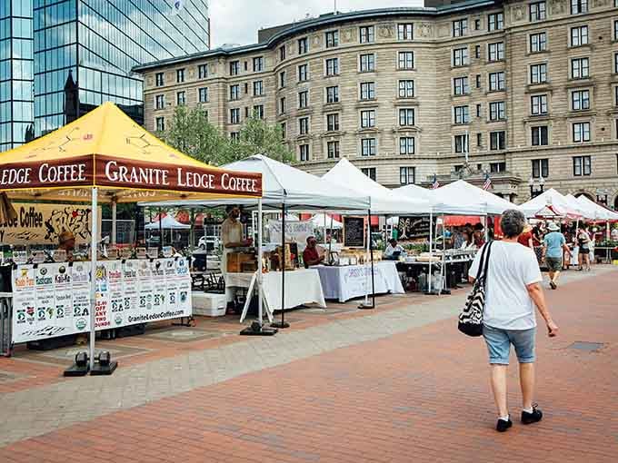 The market stretches across the plaza, proving that Boston knows how to make vegetables look downright architectural.