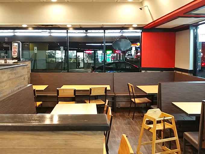 Clean lines and cozy booths create the perfect setting for your chicken and waffles adventure.