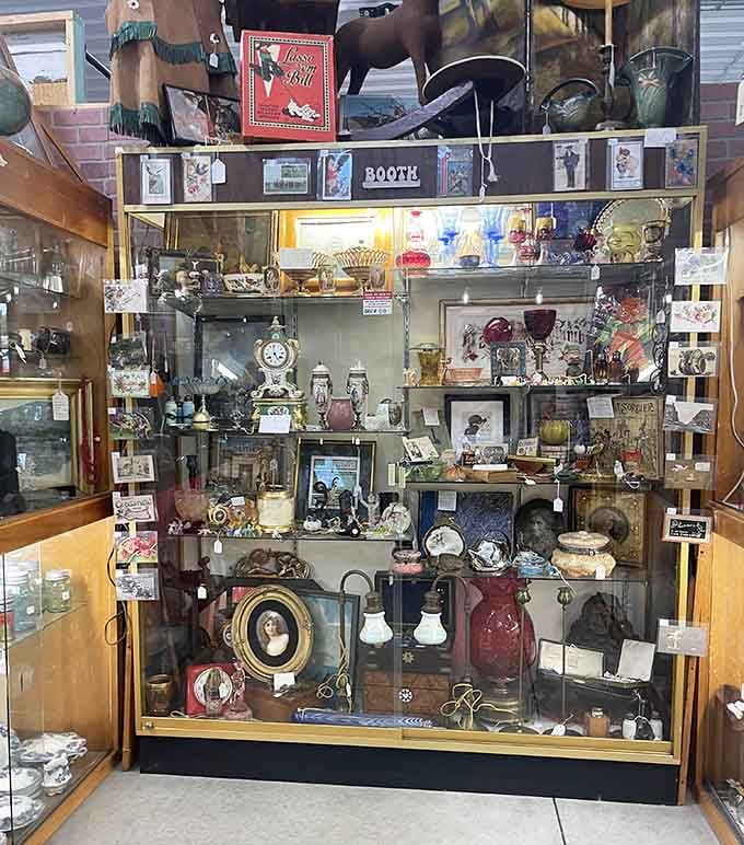 Explore a beautiful display booth packed with unique vintage items, classic clocks, and gorgeous glassware waiting to be discovered today.