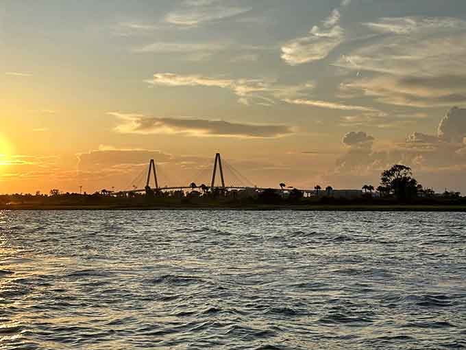 Golden hour on the water transforms an ordinary evening into something magical, with bridges silhouetted against painted skies.