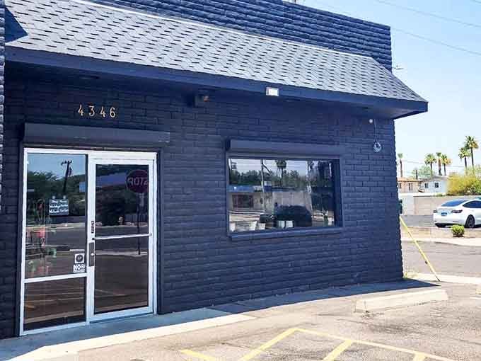 The unassuming black brick exterior hides one of Phoenix's most wonderfully weird destinations just beyond those doors.