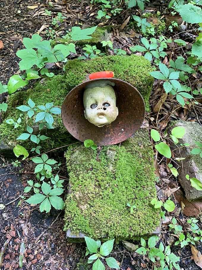 Nature's reclaiming this weathered face with vibrant moss, creating an unexpectedly beautiful portrait that Monet might've appreciated.