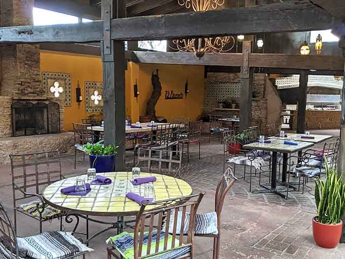 The patio whispers promises of leisurely meals where time slows down and worries fade with every margarita sip.