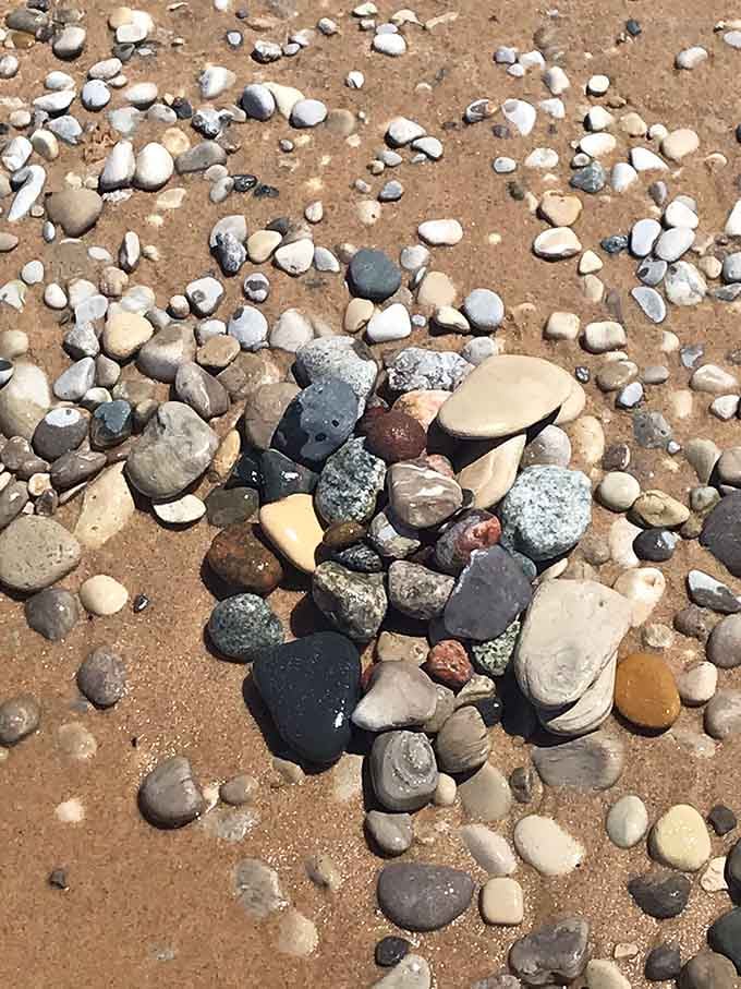 Nature's jewelry box spilled open on the sand, each stone polished smooth by Lake Michigan's patient touch.