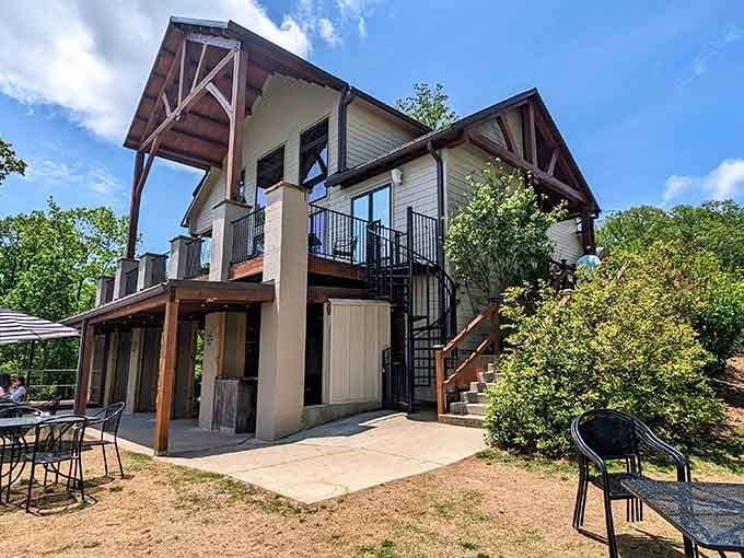 The tasting room building looks like it was designed by someone who actually understands what relaxation means.