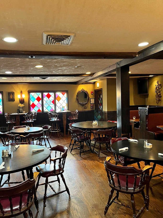 Dark wood, captain's chairs, and warm lighting create the kind of tavern atmosphere that makes everyone feel at home.