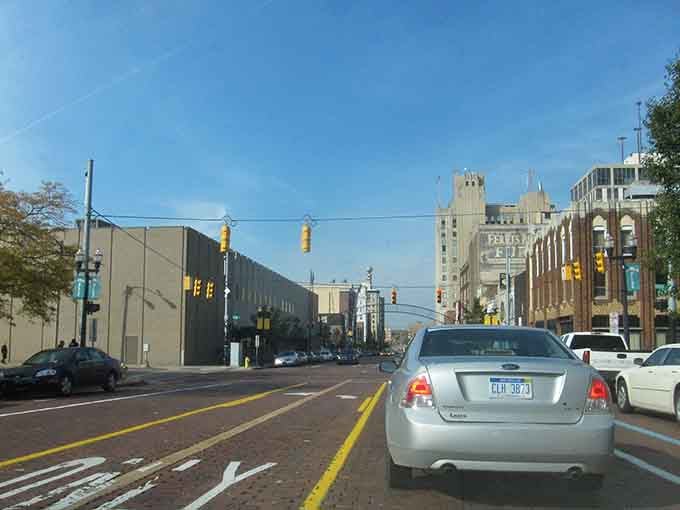 Clear blue skies frame the vintage towers and brick facades that give this downtown its timeless character.