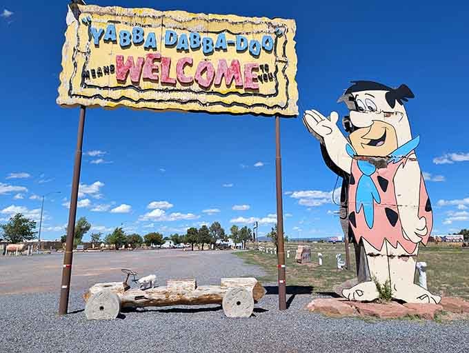Fred's enthusiastic wave greets every visitor, proving that cartoon hospitality never goes out of style in Williams.