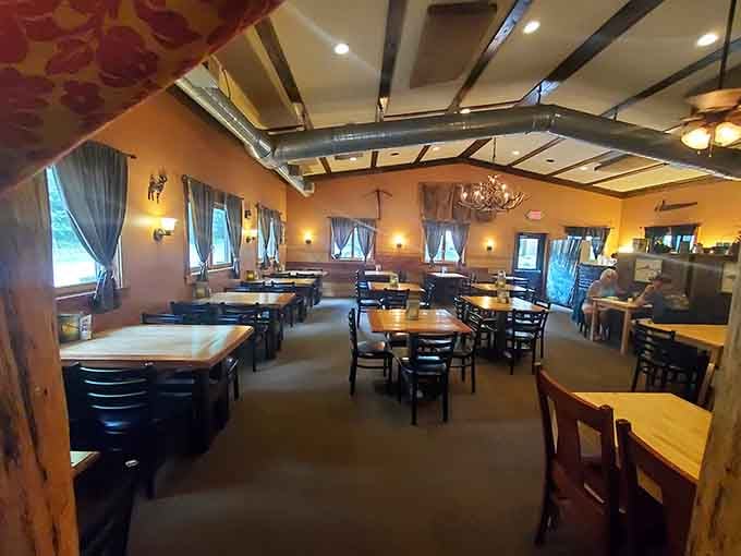 Exposed beams and warm lighting create an atmosphere that's equal parts mountain lodge and sophisticated dining room.