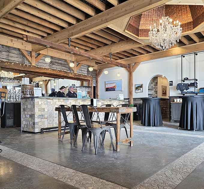 Exposed beams meet sparkling chandeliers in this tasting room where rustic charm gets a glamorous upgrade worth toasting.