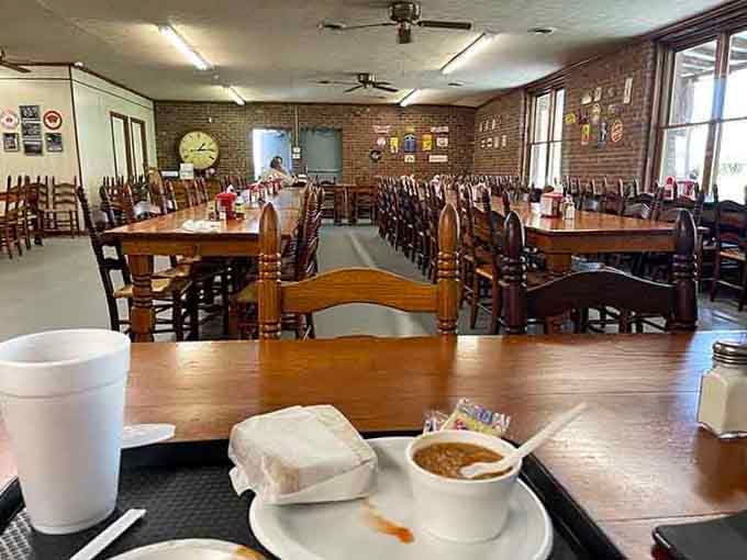 Long wooden tables ready to host your barbecue feast in a dining room that's seen decades of satisfied customers.