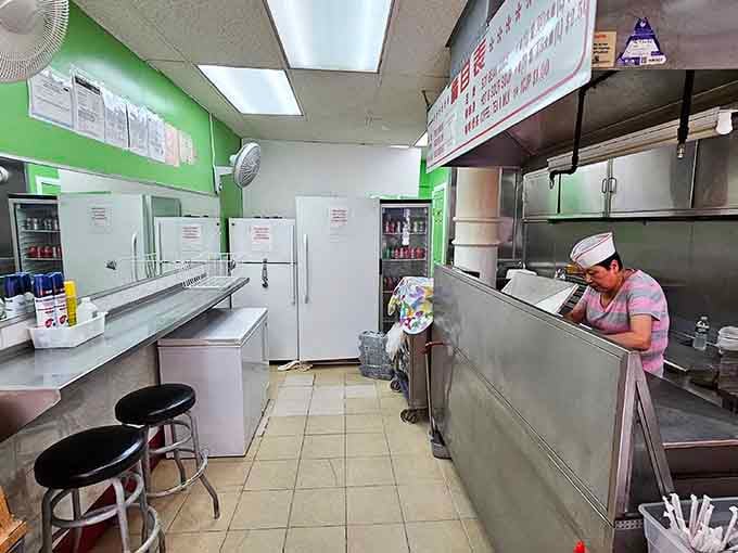 Lime green walls and metal stools: proof that great food doesn't need fancy decor to win hearts.
