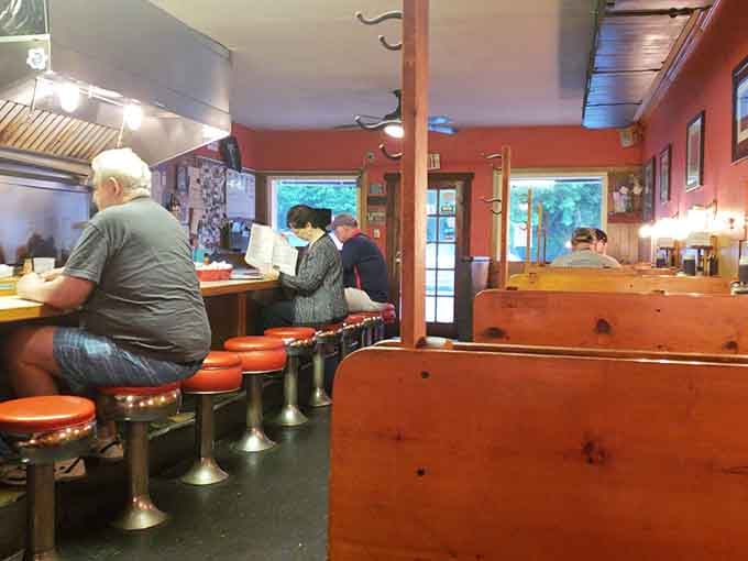 Counter seats offer front-row tickets to the pancake show, while cozy booths promise comfortable feasting.