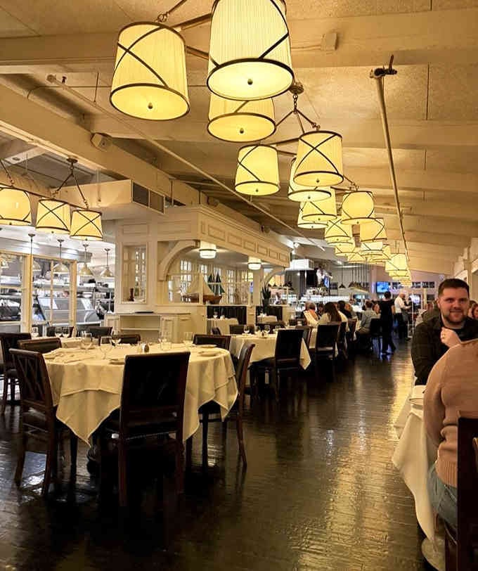 Elegant lighting and crisp linens create an upscale atmosphere that never feels stuffy or pretentious.