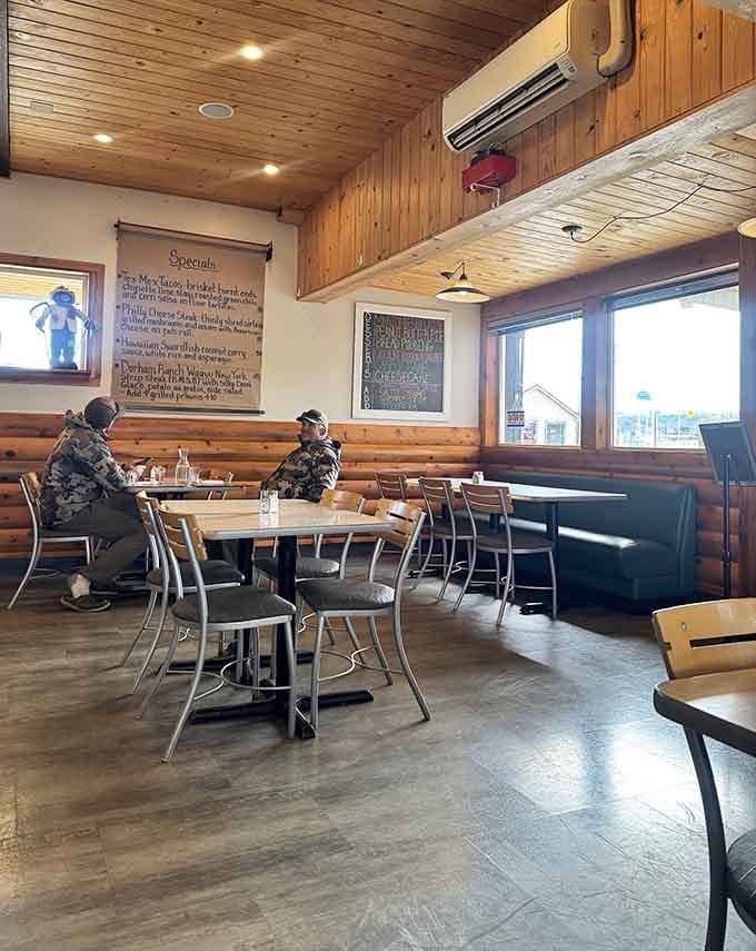 Wood-paneled walls and comfortable booths create the kind of cozy atmosphere where good meals become great memories.