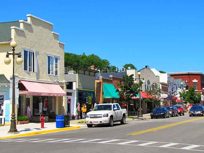 Those colorful awnings aren't just for show; they're practically begging you to slow down and window shop.