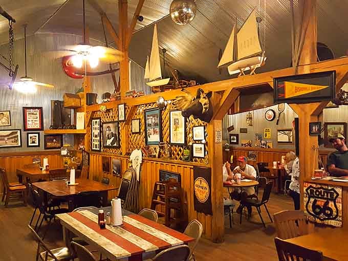 Model sailboats and vintage signs compete for ceiling space while diners enjoy their meals in this wonderfully cluttered treasure trove.