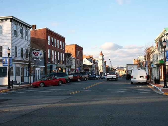 Main Street magic captured at golden hour, when the lighthouse beckons like a beacon of possibility.