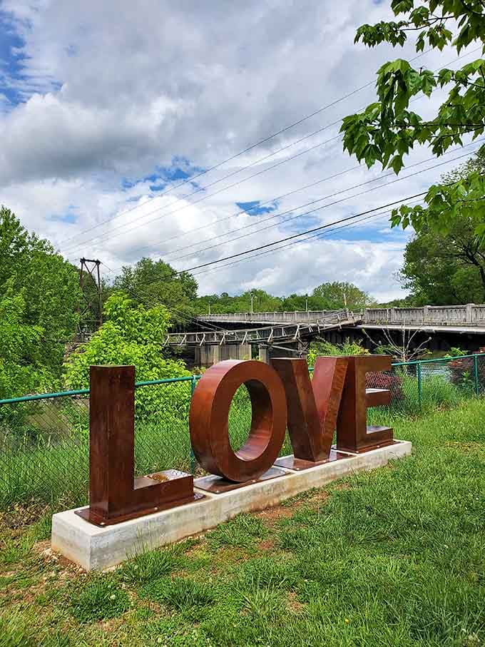 Nothing says "small town charm" quite like giant letters spelling LOVE near a suspension bridge.