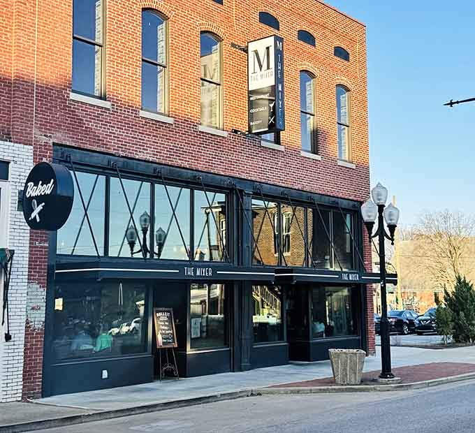 The Mixer's sleek black storefront against historic brick creates the kind of contrast that makes architects weep with joy.