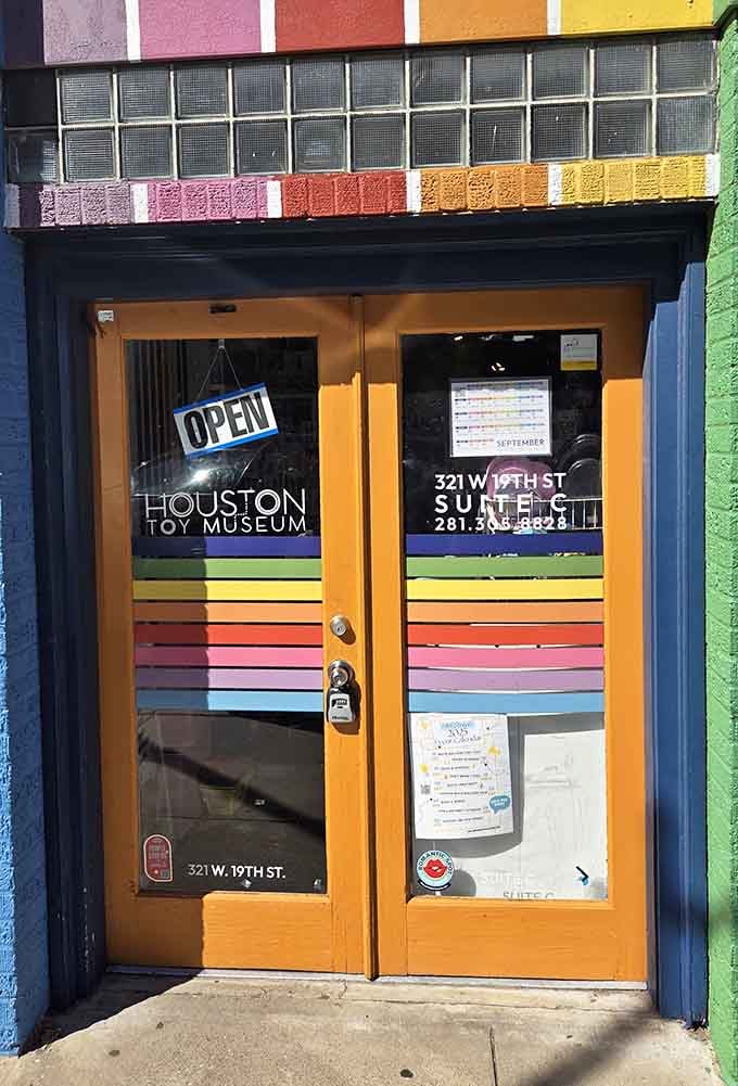 That rainbow-striped entrance isn't just decoration; it's a promise that childhood joy lives inside these doors.