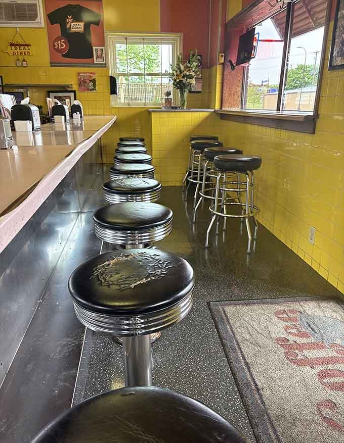 Chrome stools and yellow tile walls create the kind of diner atmosphere that makes everything taste better somehow.