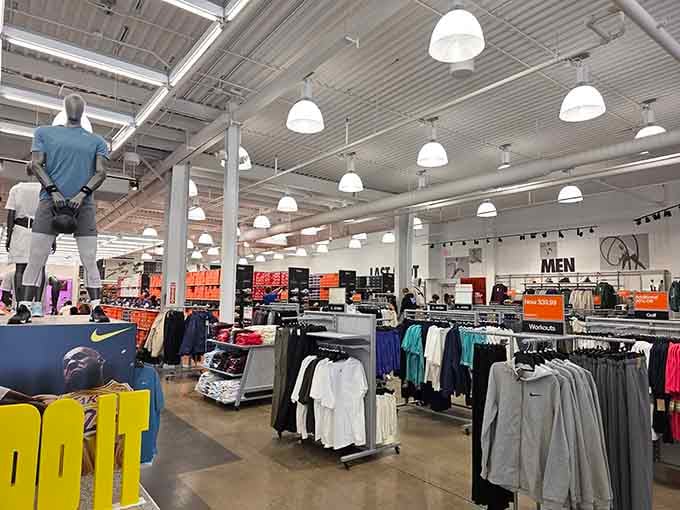 The Nike section stretches before you like an athletic wonderland where your wallet meets its match in swooshes.