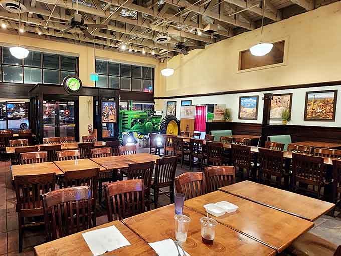 High ceilings, wooden chairs, and that vintage tractor say "relax, you're about to eat really well."