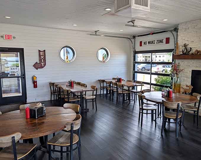 Clean, bright, and nautical without the kitsch. Those porthole windows mean business about freshwater fish.