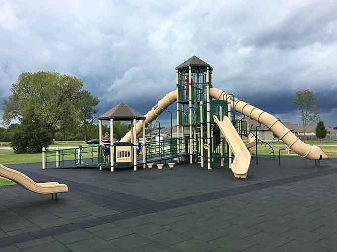 Multiple slides, climbing towers, and rubber flooring beneath it all. Someone thought this through nicely.