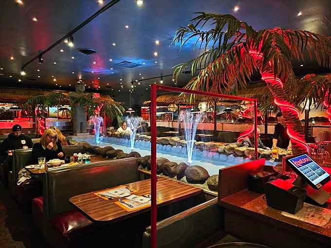 Waterfalls, palm trees, and color-changing lights transform your dinner into a tropical escape without the airfare.