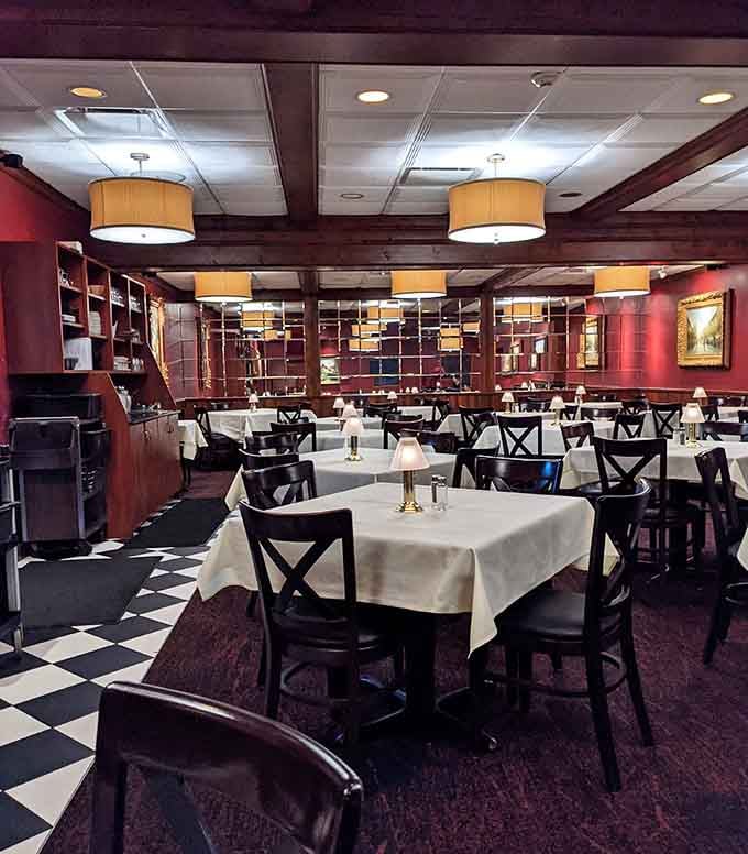 Classic checkered floors and white tablecloths create that timeless steakhouse vibe your parents would absolutely approve of.