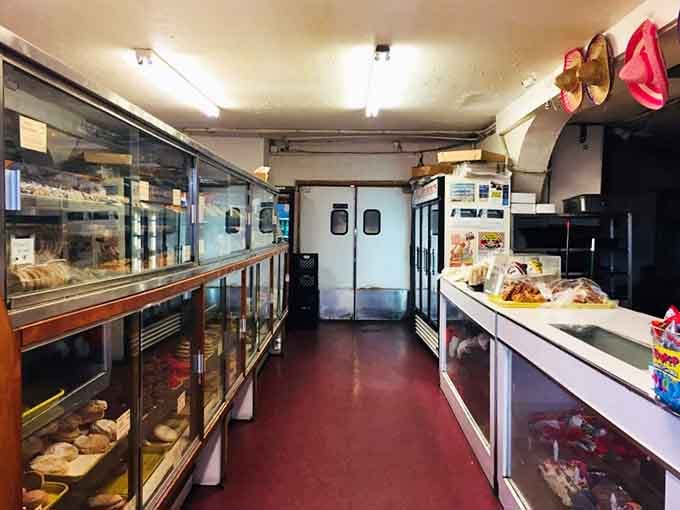 Long glass cases, red floors, and the quiet hum of a kitchen that means serious business.