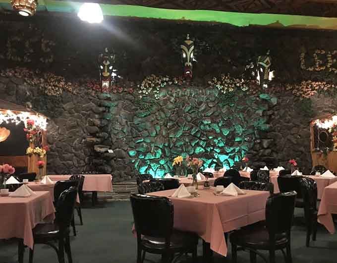 That rock wall with atmospheric lighting transforms a dining room into an island grotto worthy of a Gilligan's Island fantasy.