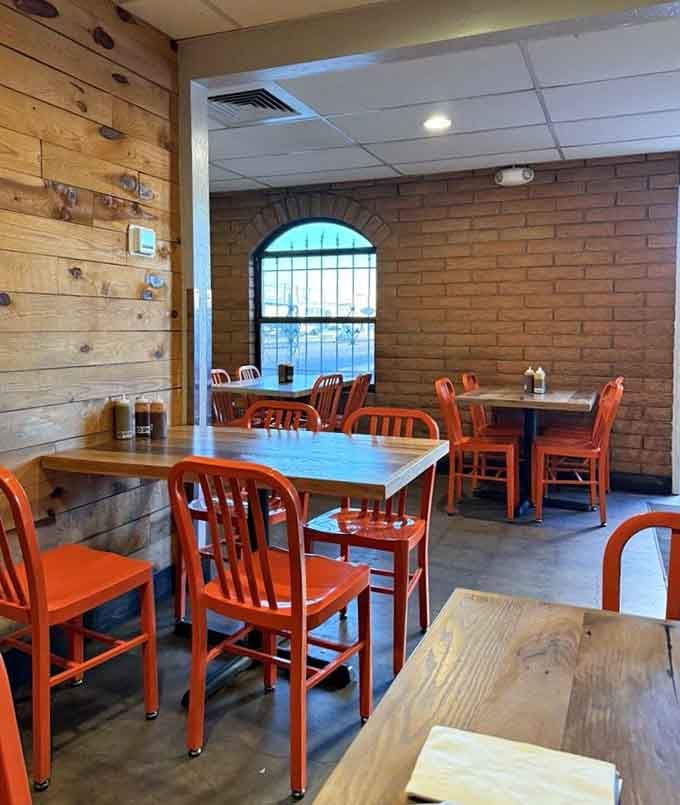 Orange chairs and wood paneling create the perfect no-frills setting where exceptional meat takes center stage beautifully.