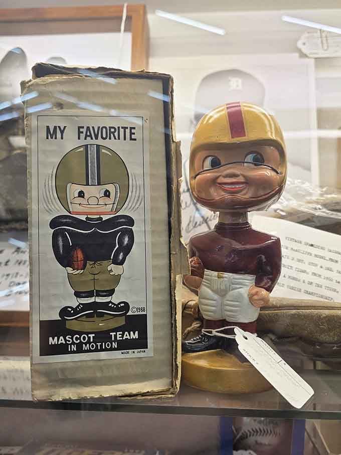 That vintage bobblehead has seen more football seasons than most of us, and it's still nodding in approval.