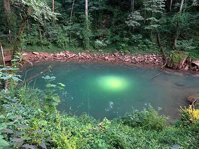This impossibly turquoise blue hole looks like someone photoshopped the Caribbean into Kentucky's backyard.