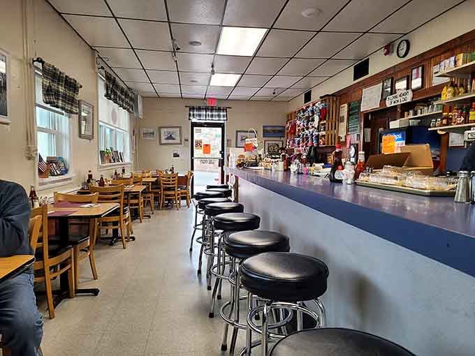 Classic counter seating where coffee flows endlessly and conversations happen naturally between bites of perfection.