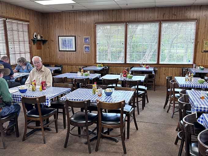 Wood paneling and checkered tablecloths create the perfect setting for serious Southern comfort food conversations.