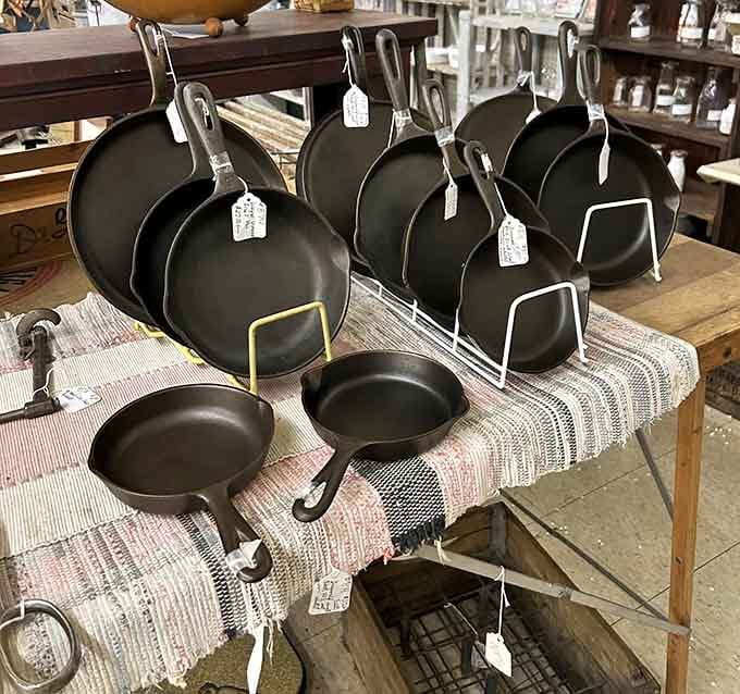 Cast iron skillets that'll outlive your grandchildren, displayed like the indestructible treasures they truly are.