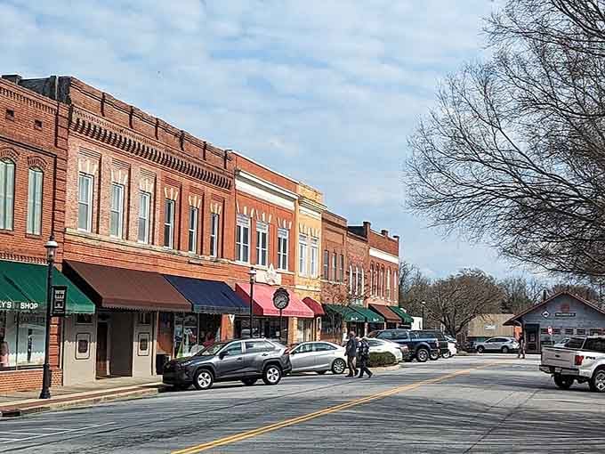 These historic storefronts have witnessed more genuine community moments than a thousand modern strip malls ever will combined.