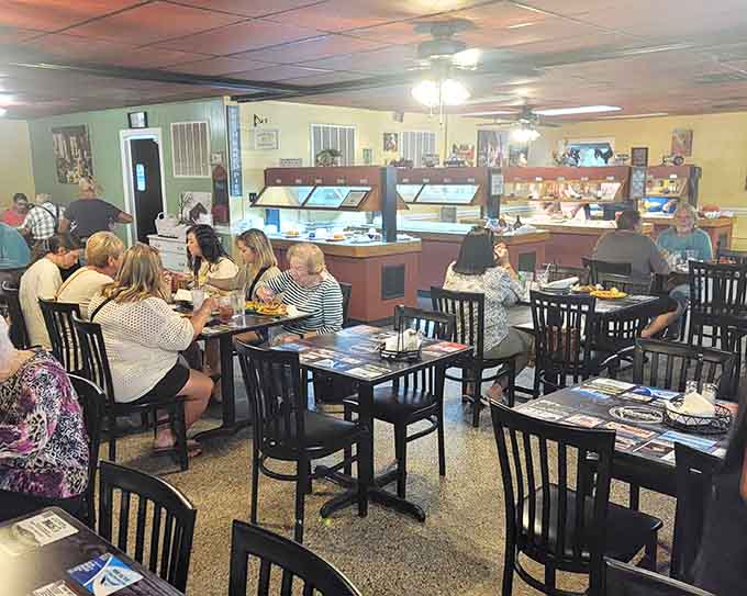Inside, happy diners gather around tables while the real stars shine under those warming lights.