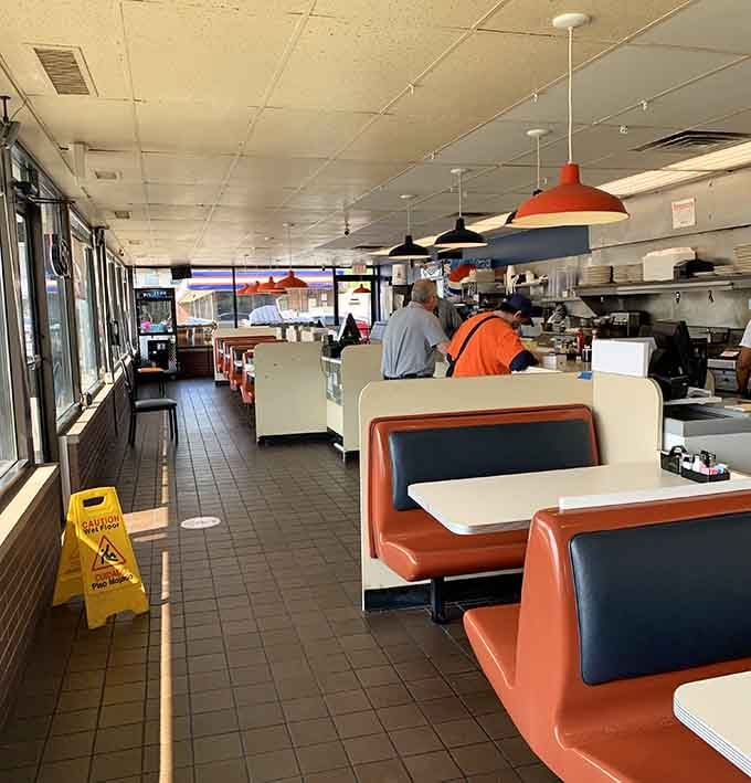 Classic diner booths and pendant lights create the perfect stage where breakfast dreams become delicious reality every single day.