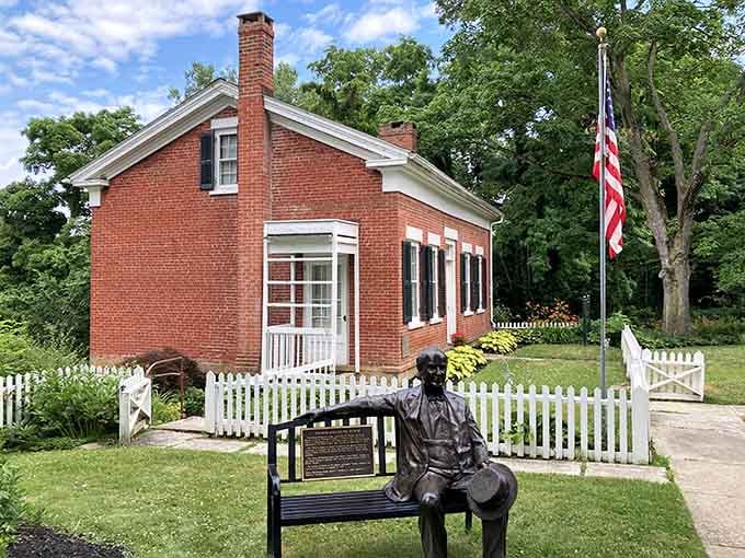 Young Edison sits outside his birthplace, forever pondering the next big idea. The genius started right here in this humble brick home.