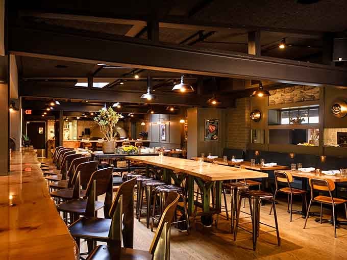 Modern rustic done right, where exposed beams meet comfort food and nobody's complaining about the seating arrangements.