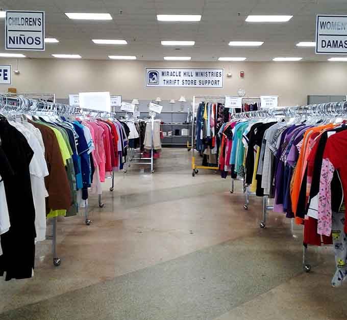 Rows of colorful clothing stretching into the distance like a rainbow made entirely of second chances and savings.