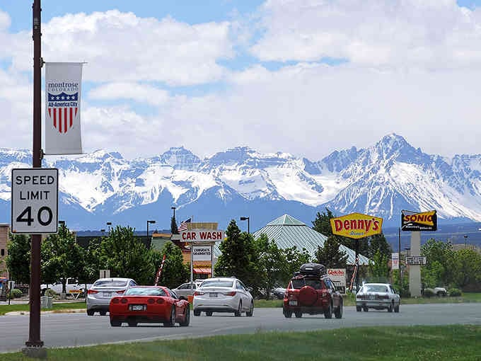 Snow-capped San Juan Mountains frame everyday errands, turning a grocery run into a postcard moment.