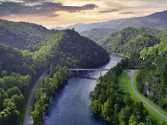 Two ribbons of asphalt following the river through paradise, because one lane each direction is all you need.